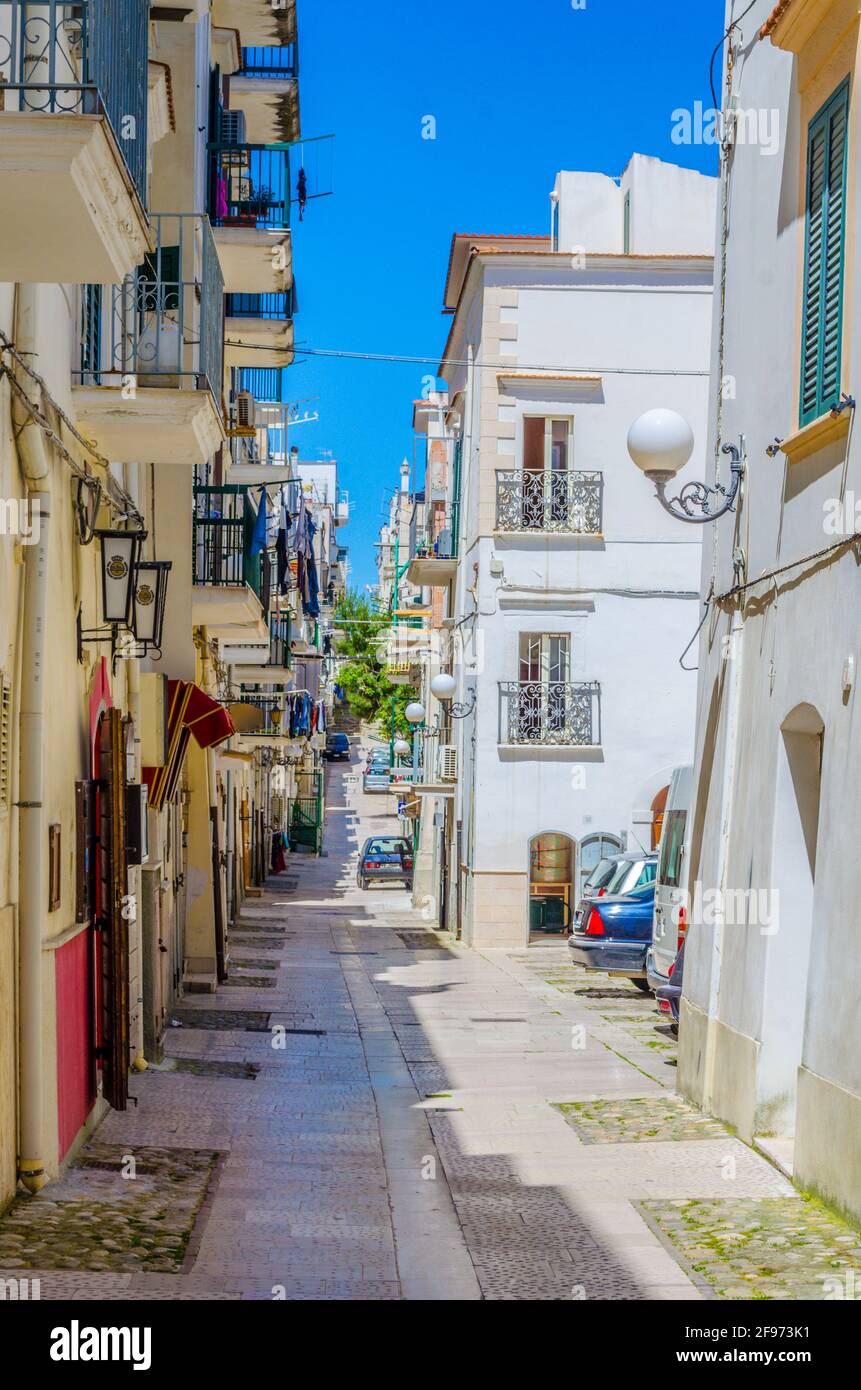 View of a narrow street in the Italian city Vieste Stock Photo - Alamy