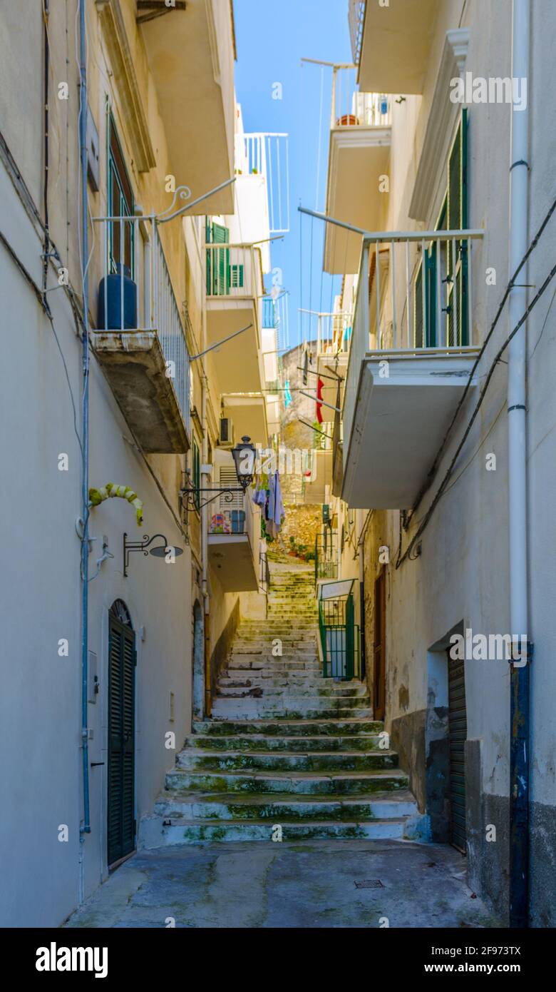 View of a narrow street in the Italian city Vieste Stock Photo - Alamy