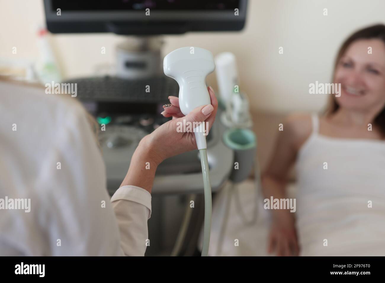 Doctor conducts ultrasound scan on woman closeup Stock Photo - Alamy