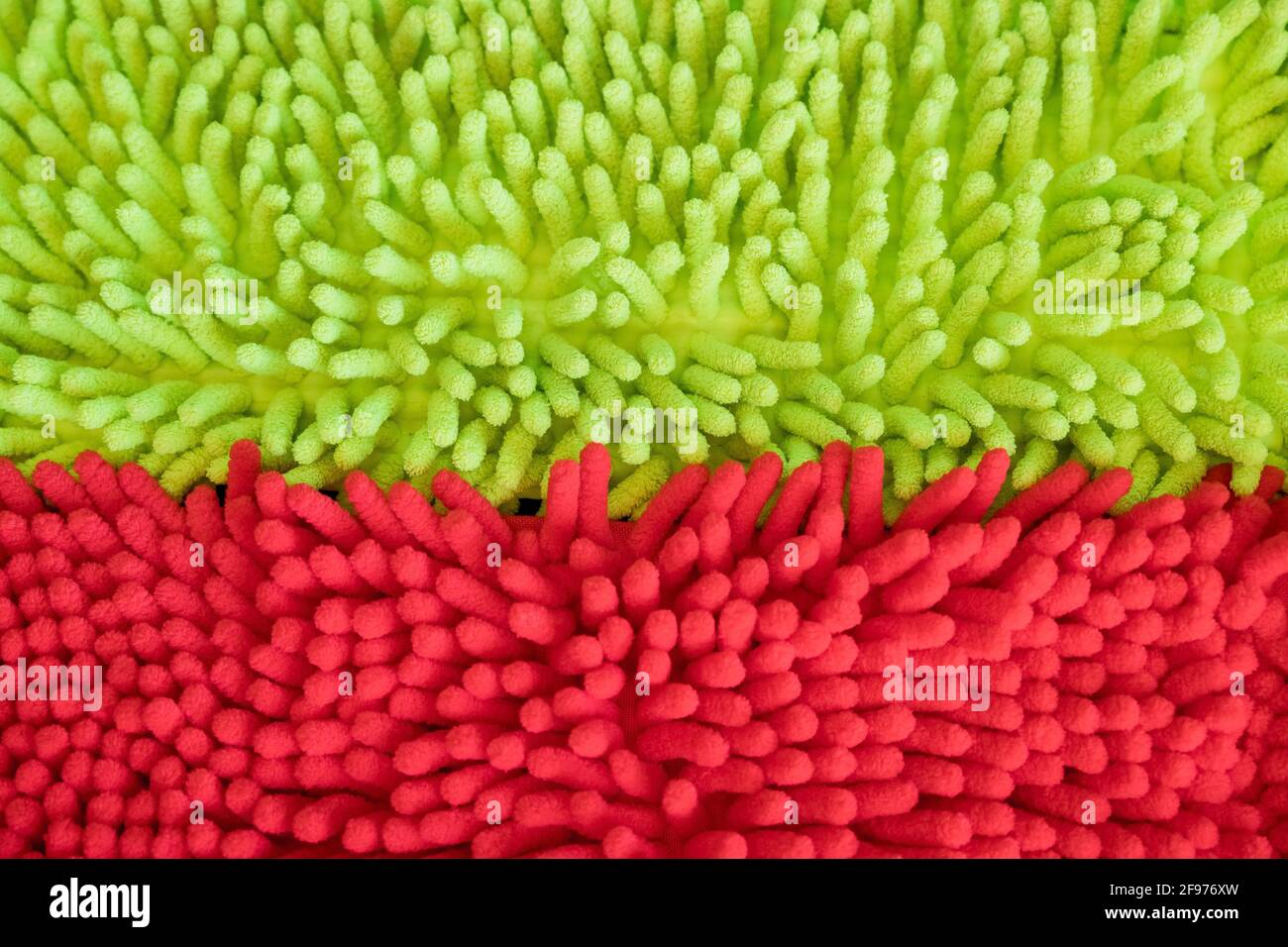 Microfiber texture with a soft large pile. Top view texture of orange ...