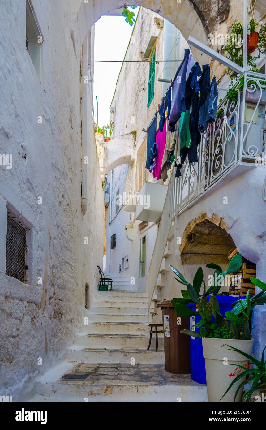 View of a white narrow street in the Italian city Ostuni Stock Photo ...