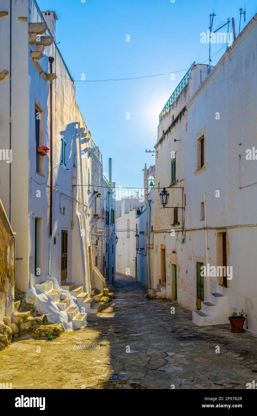 View of a white narrow street in the Italian city Ostuni Stock Photo ...