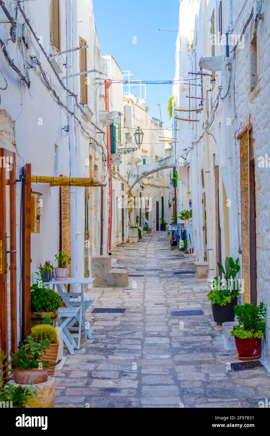 View of a white narrow street in the Italian city Ostuni Stock Photo ...