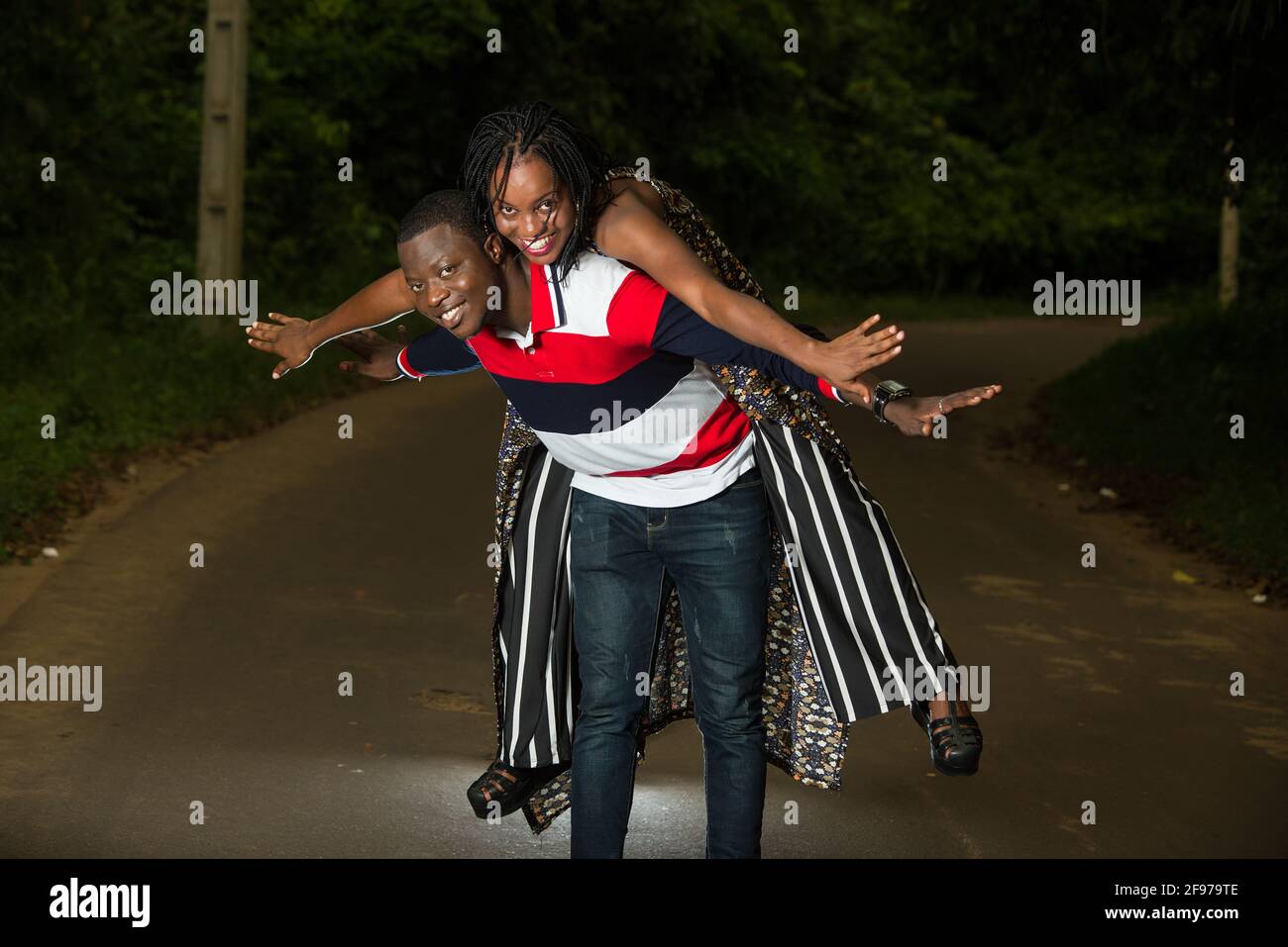 happy young man carrying his companion also happy Stock Photo - Alamy