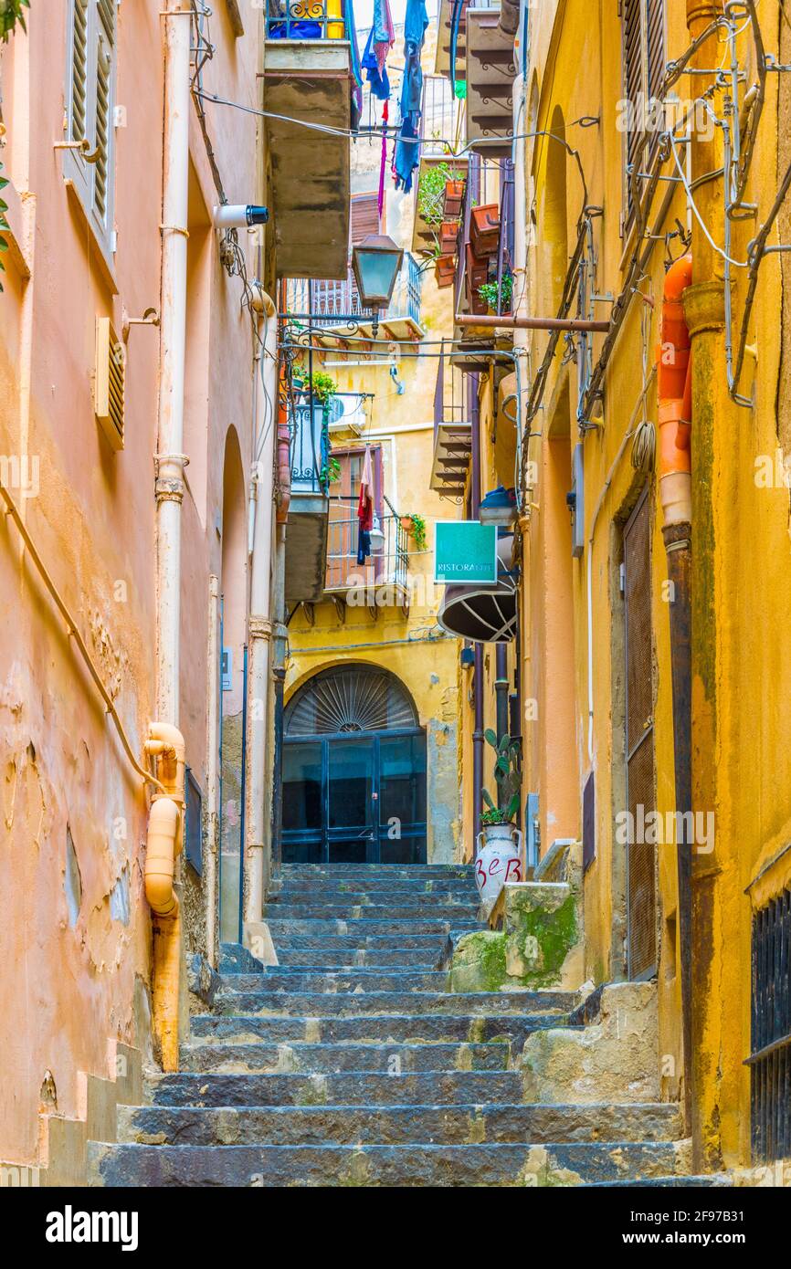 View of a narrow street in the historical city of Agrigento in Sicily ...