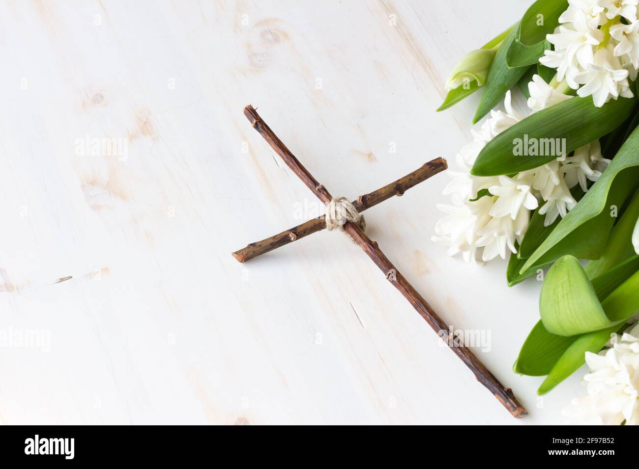 border of christian cross and white tulips and hyacinth flowers on ...