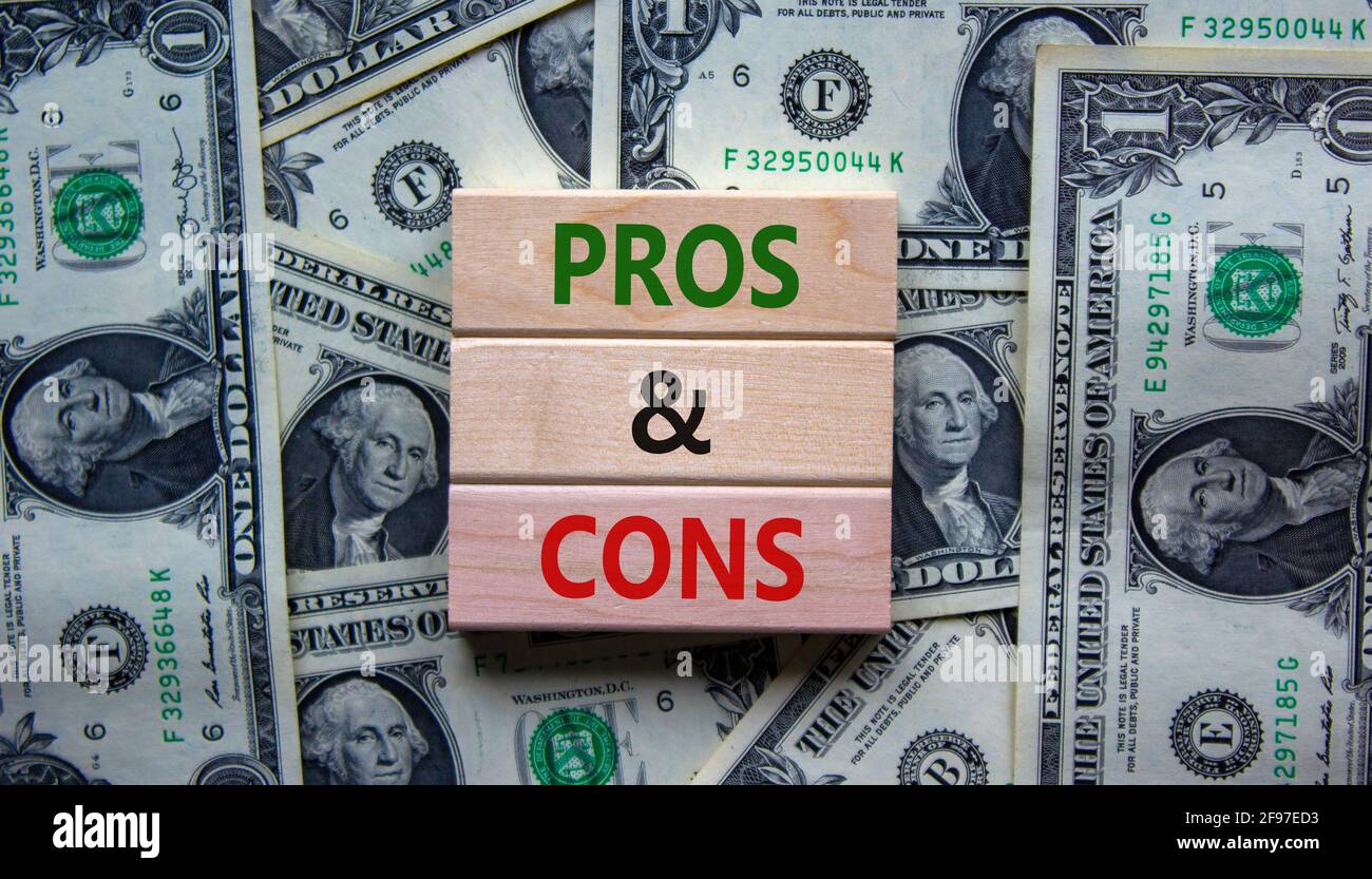 Pros and cons symbol. Wooden blocks with words 'Pros and cons ...