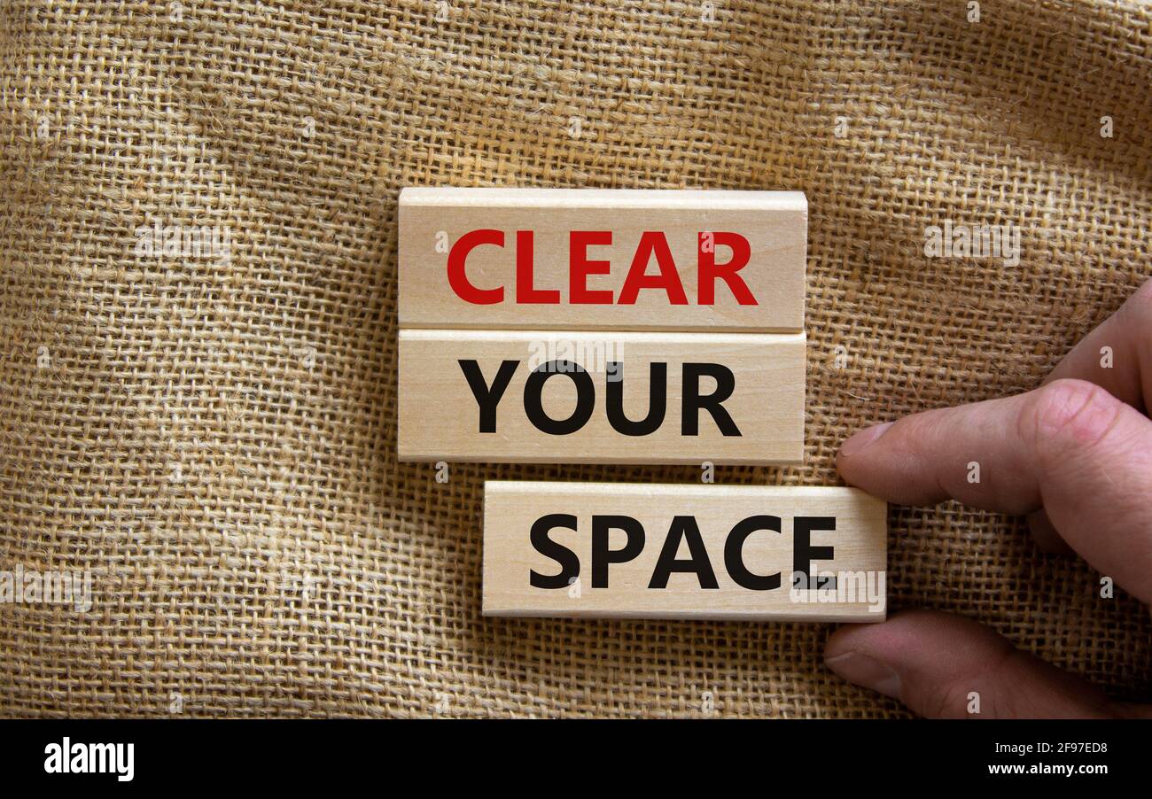 Clear your space symbol. Wooden blocks with words 'Clear your space ...