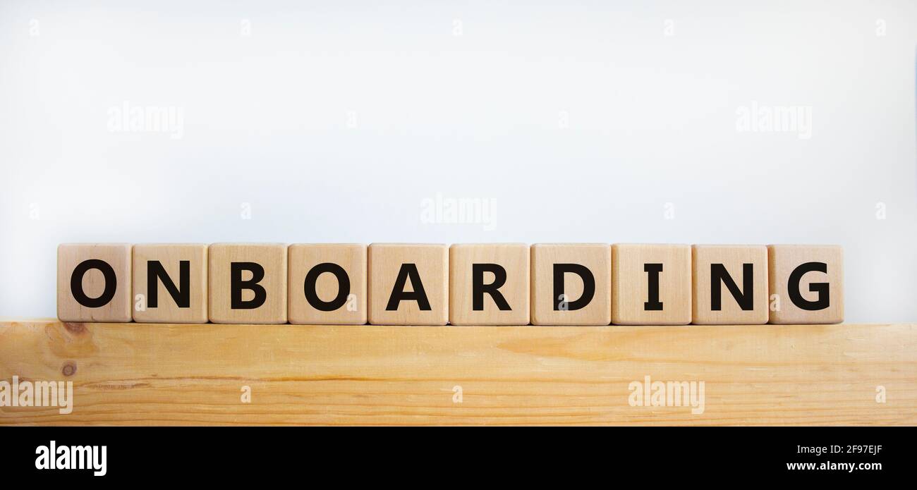 Onboarding symbol. The word 'Onboarding' on wooden cubes. Business and ...