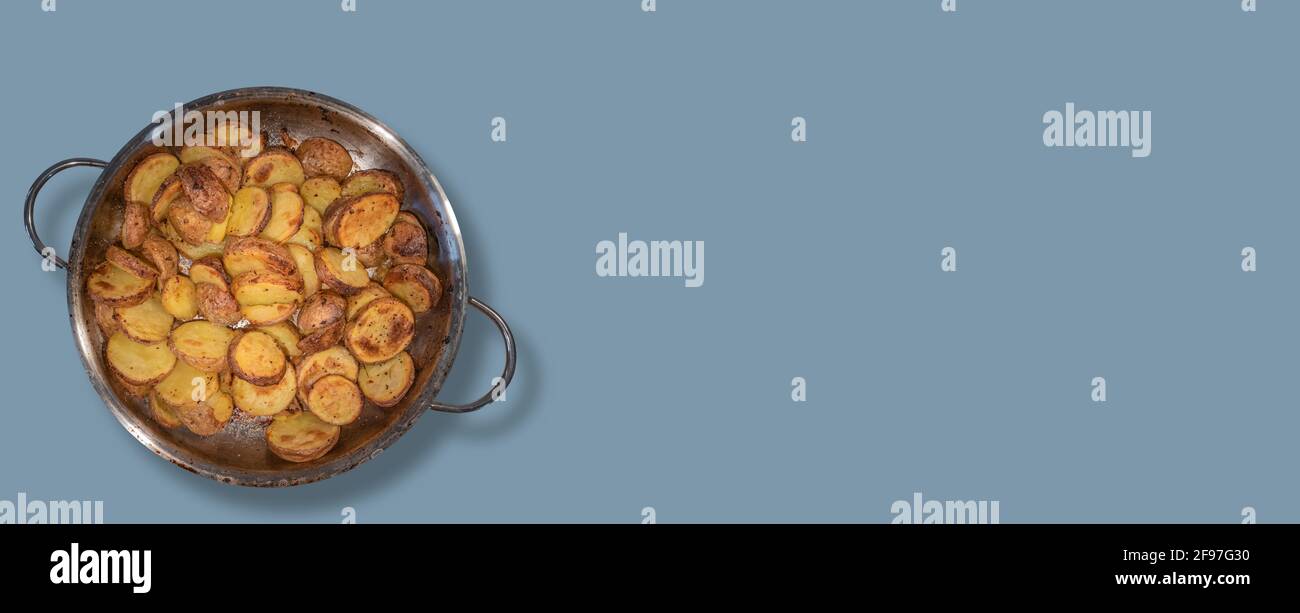 Banner with a big frying pan filled with hot just baked western country ...