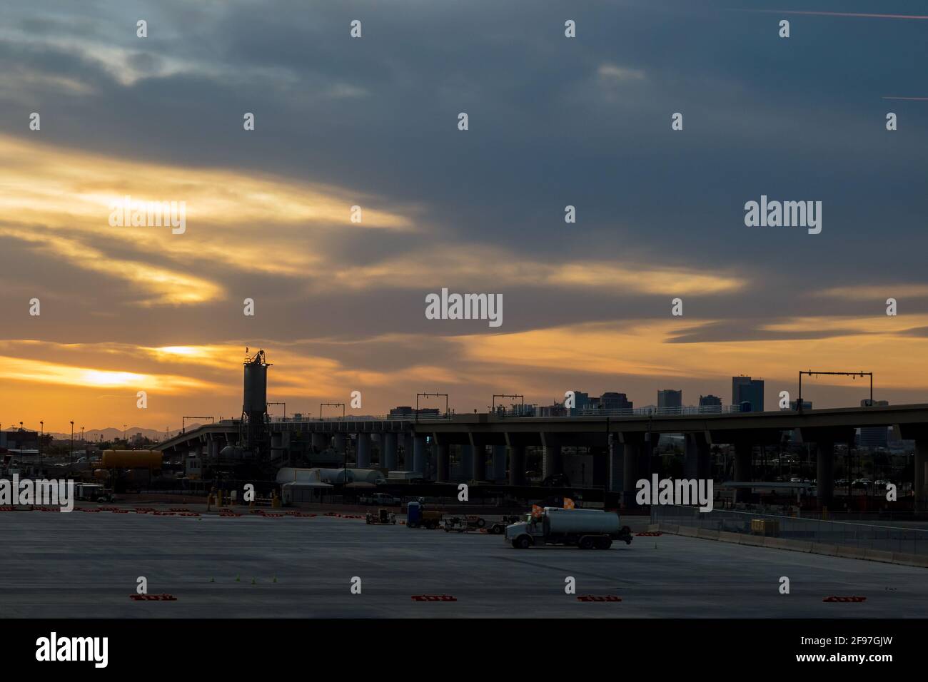 Airplane at the terminal gate international airport during sunset Stock ...