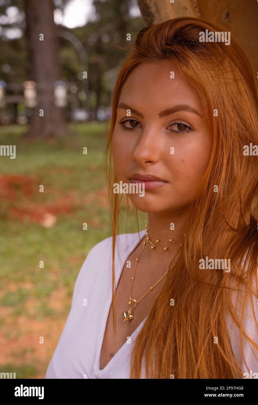 red haired model strike a pose for jewelry Stock Photo - Alamy