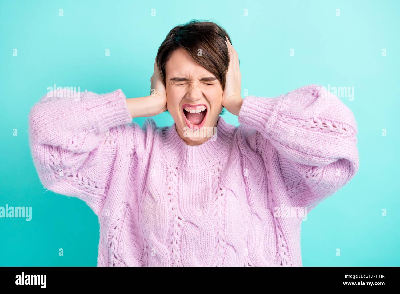 Photo Of Upset Annoyed Young Woman Wear Violet Sweater Arms Close Ears