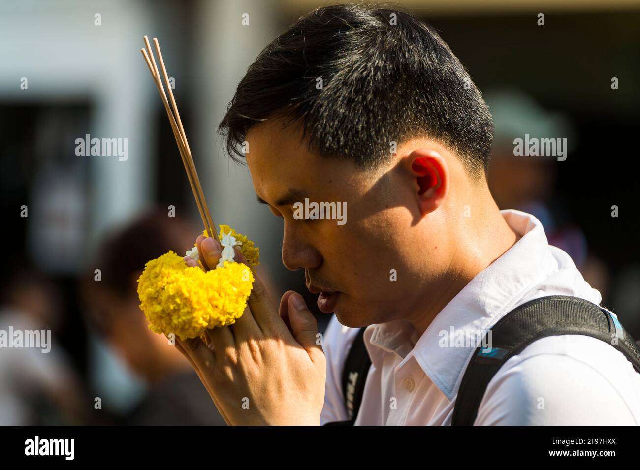 Thailand, Bangkok, believers at Erawan Shrine, prayer, incense sticks ...