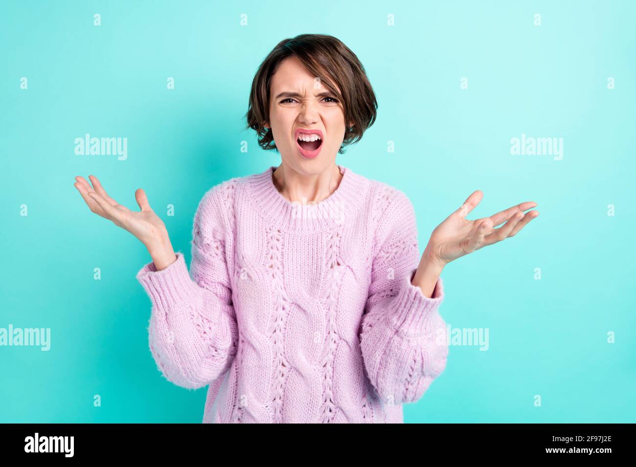 Photo Of Angry Upset Young Woman Wear Violet Sweater Rising Arms