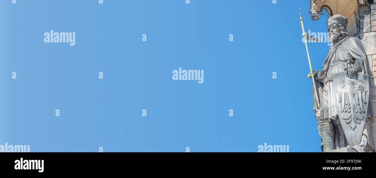 Banner with ancient statue of Knight in armor with spear and shield at ...