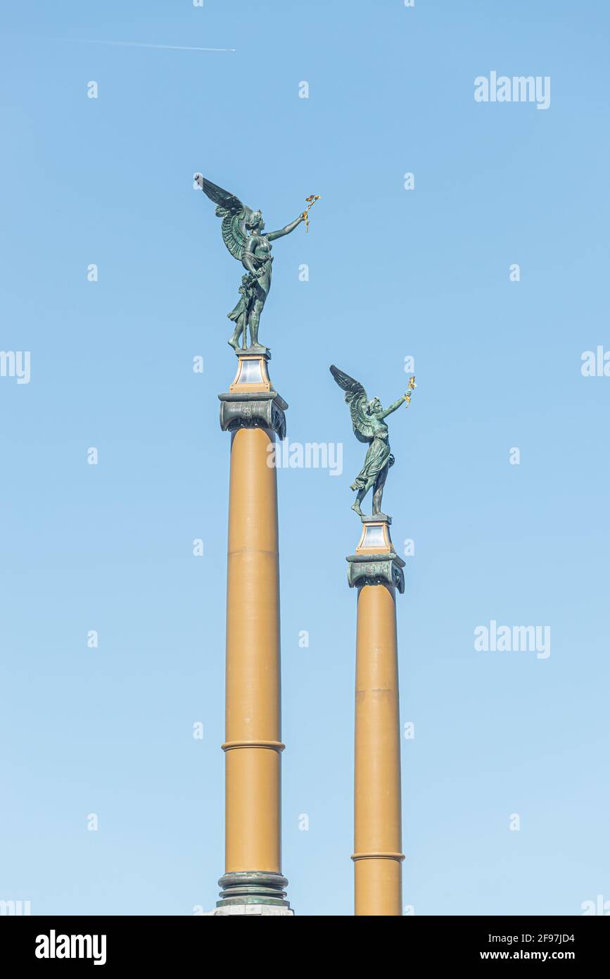 Statue of beautiful angels with wings at the top of columns in Prague ...