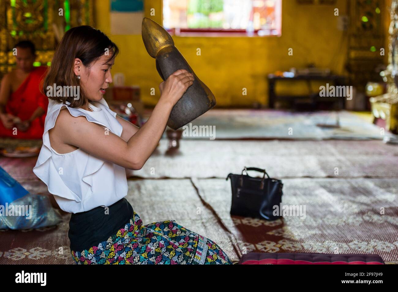 Laos, Vientiane, the temple Vat Simuang, woman, prayer Stock Photo - Alamy