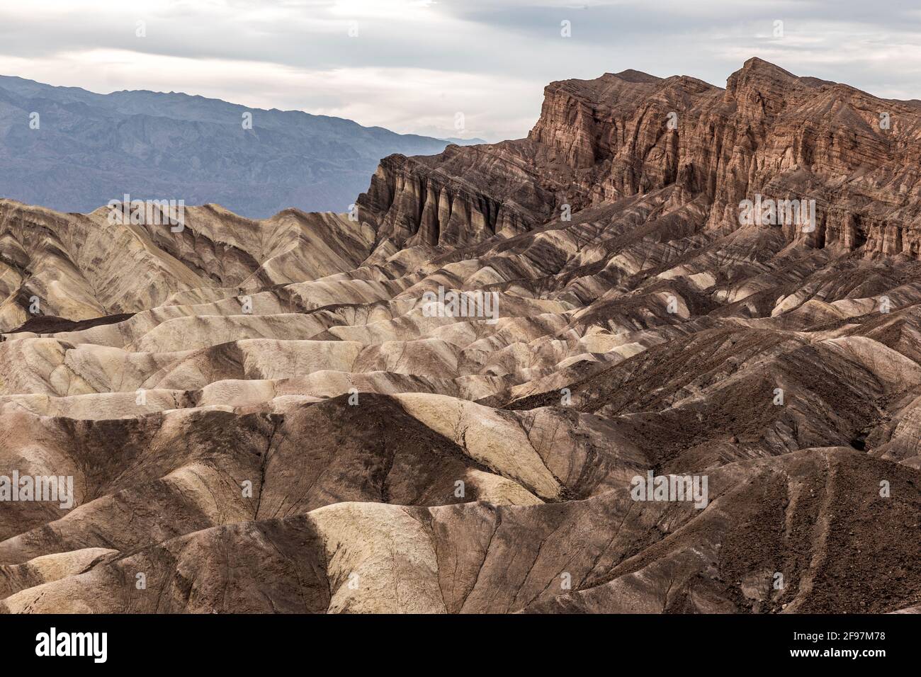 A picturesque desert-Scene with heavily eroded Ridges taken at the well ...