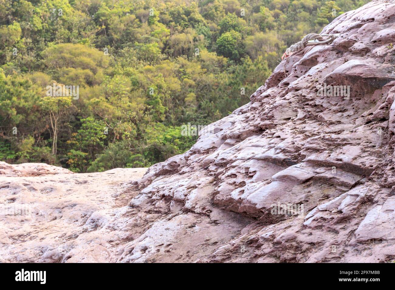 Fragile rocks that is pink in color because of oxidized iron minerals ...