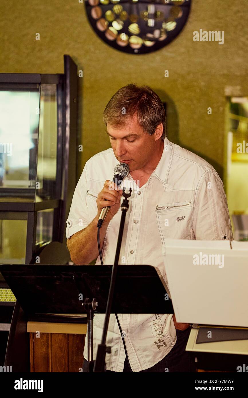 Song leaders at a family event Stock Photo - Alamy