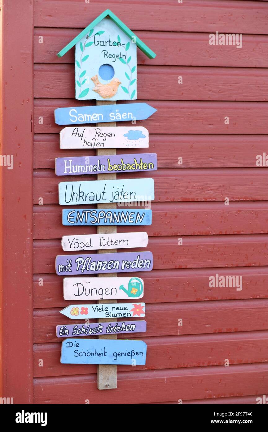 Sign in the garden with the garden rules Stock Photo - Alamy