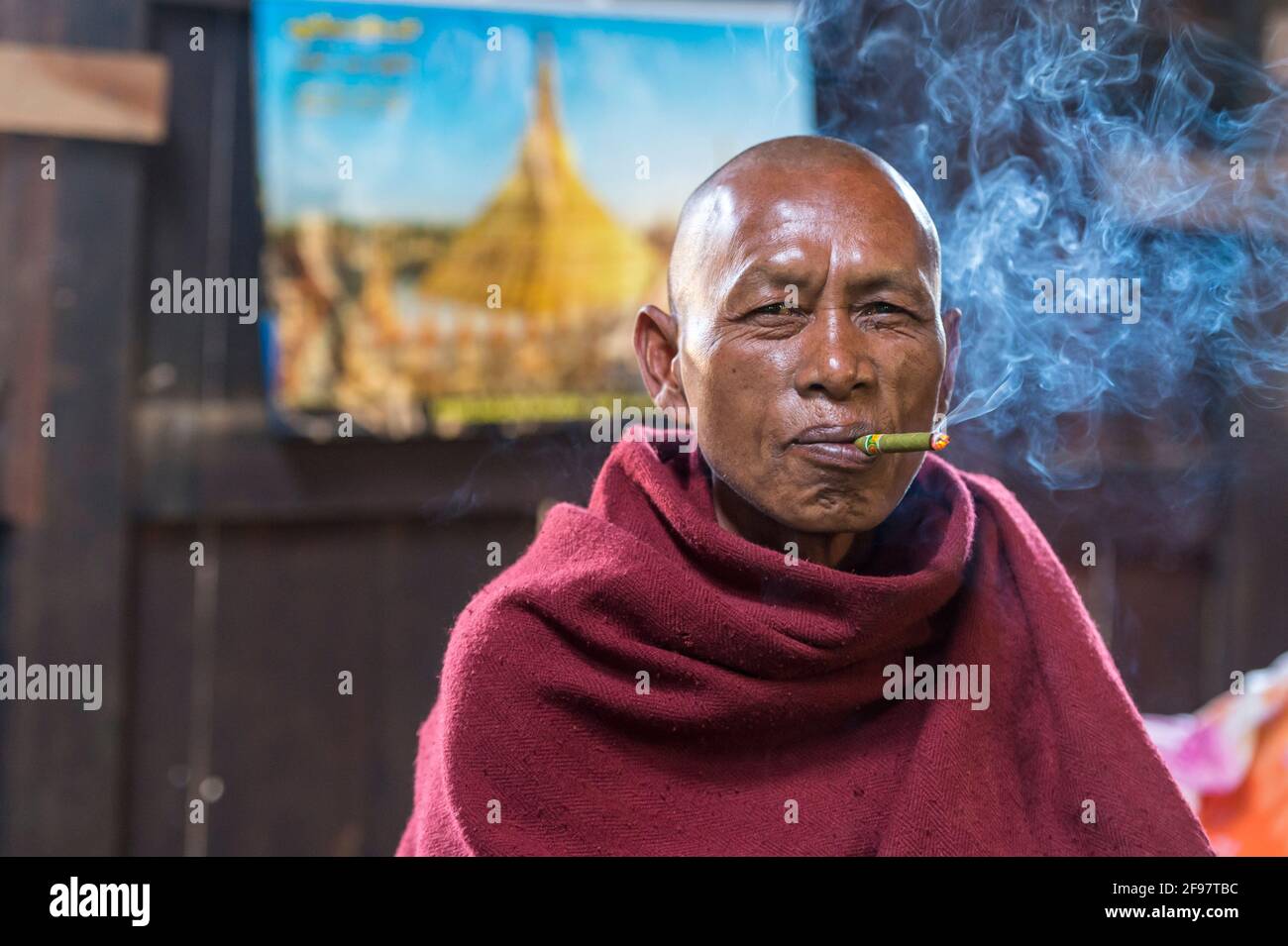 Myanmar, scenes at Inle lake, Phyu Nge monastery, monk, smoking ...