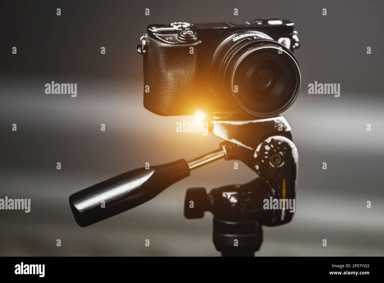 Professional camera on a tripod Stock Photo - Alamy