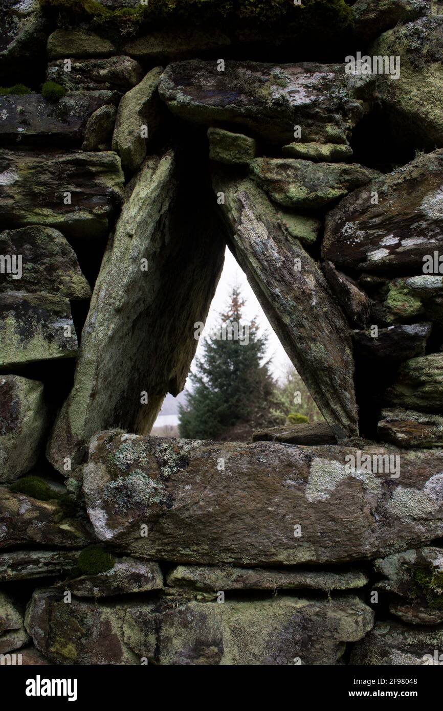 A triangle window in a old castle ruins in the highlands of Scotland ...