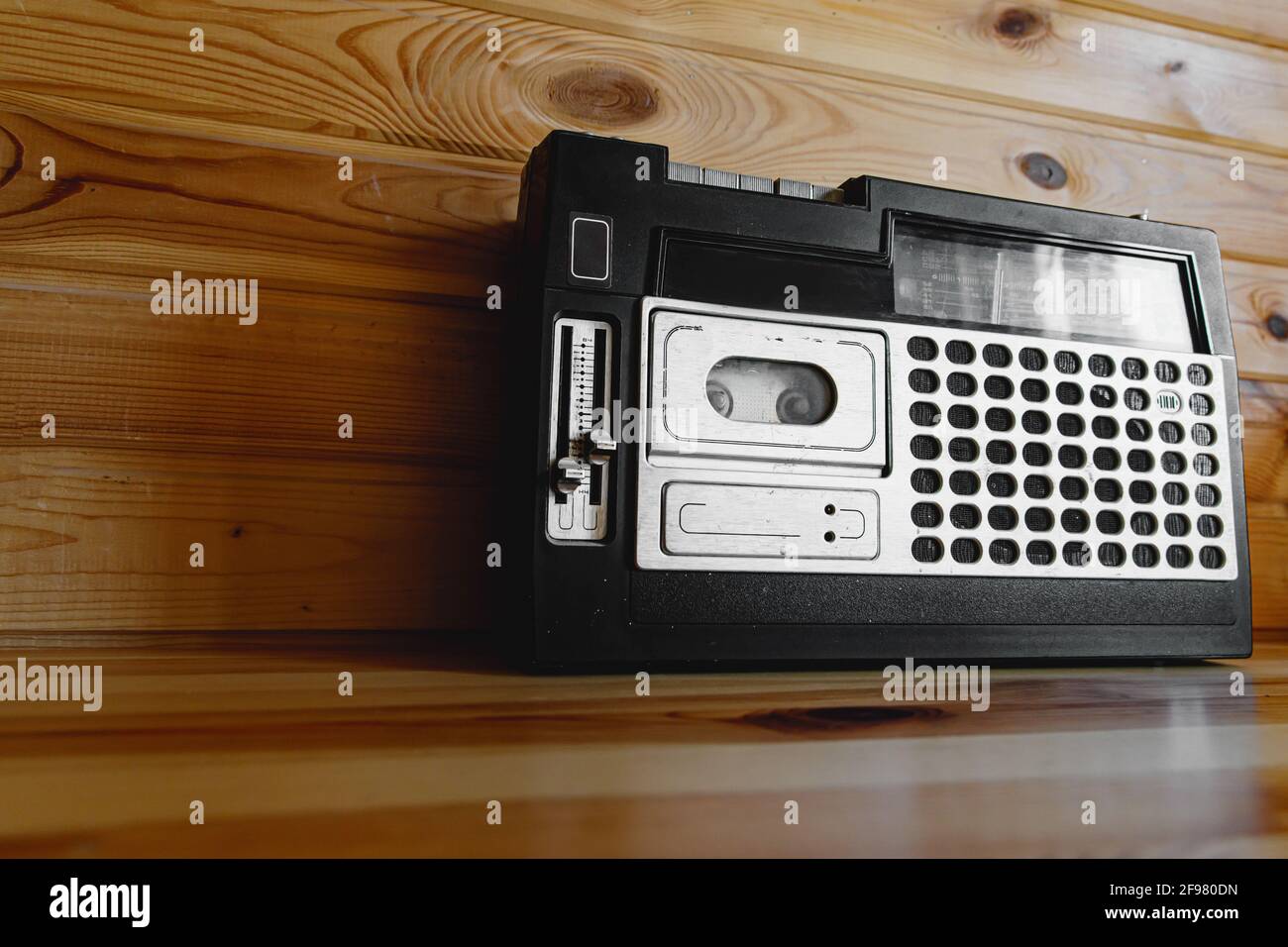 Retro oldschool design radio cassette tape recorder on wooden table ...