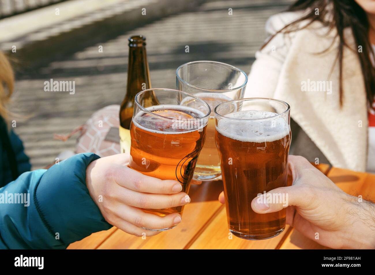 Group of people clinking beer glasses Stock Photo - Alamy