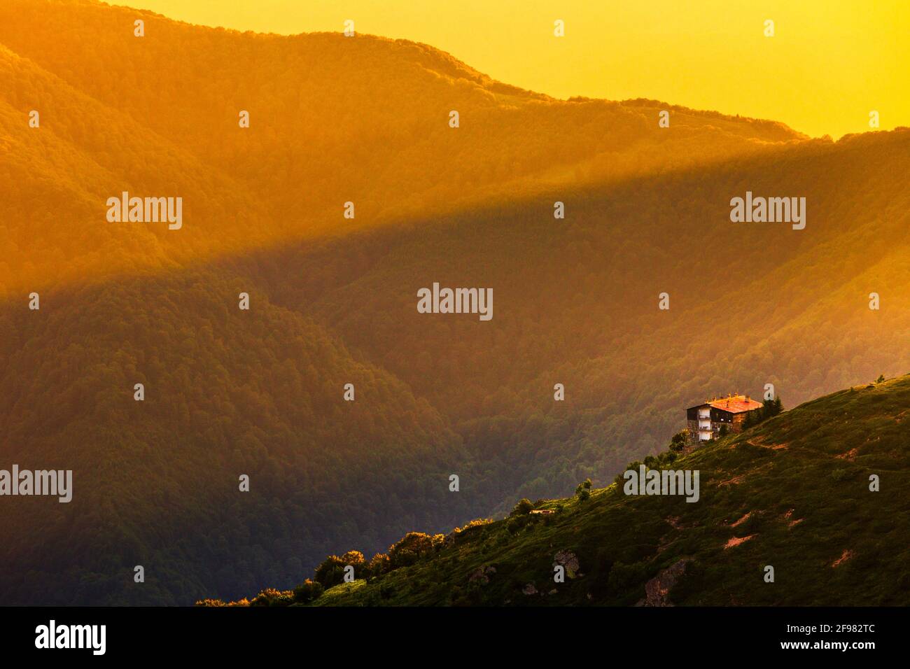 Summer Light - Mountain hut at sunset time Stock Photo - Alamy