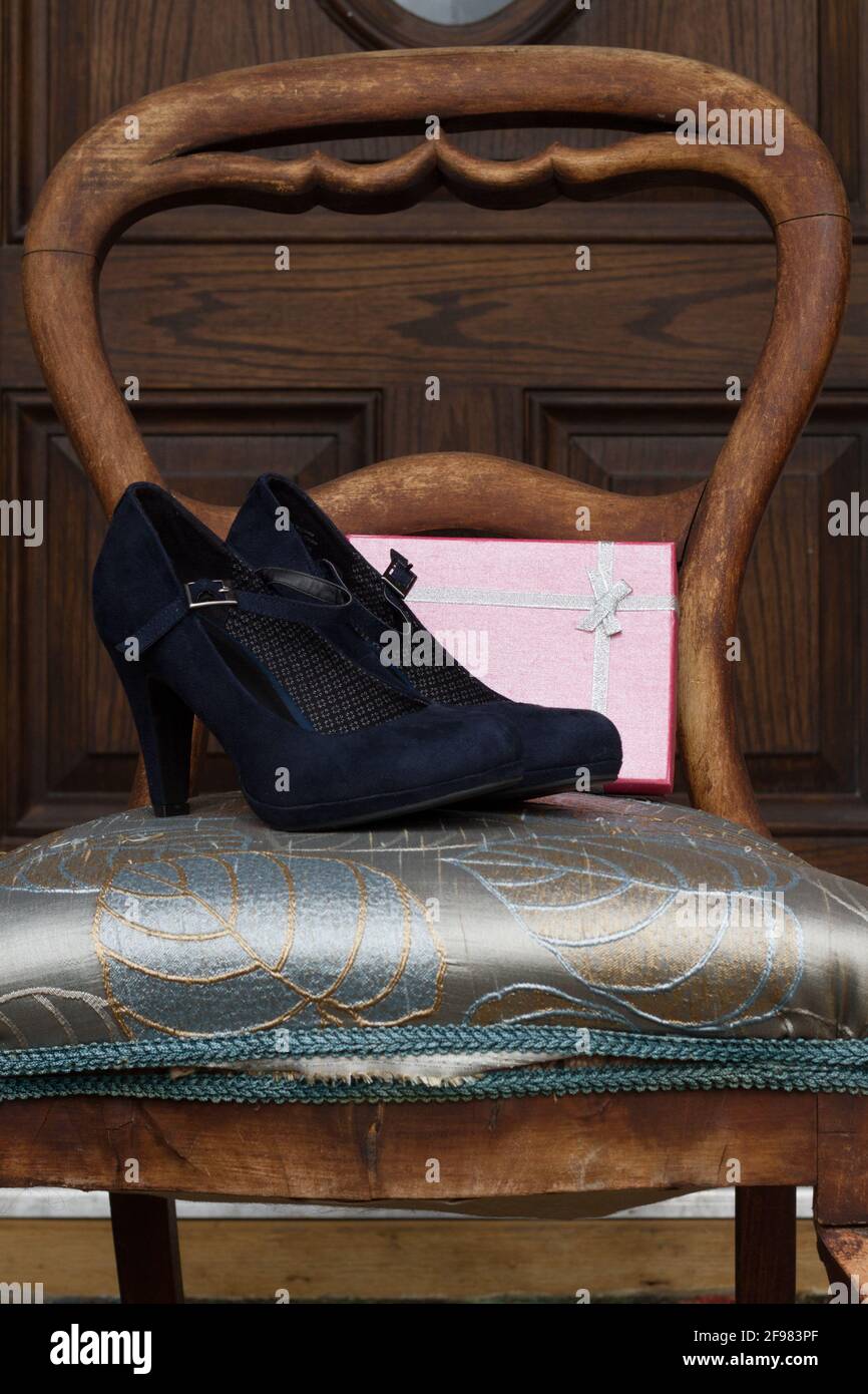 On chair black shoes hi-res stock photography and images - Alamy