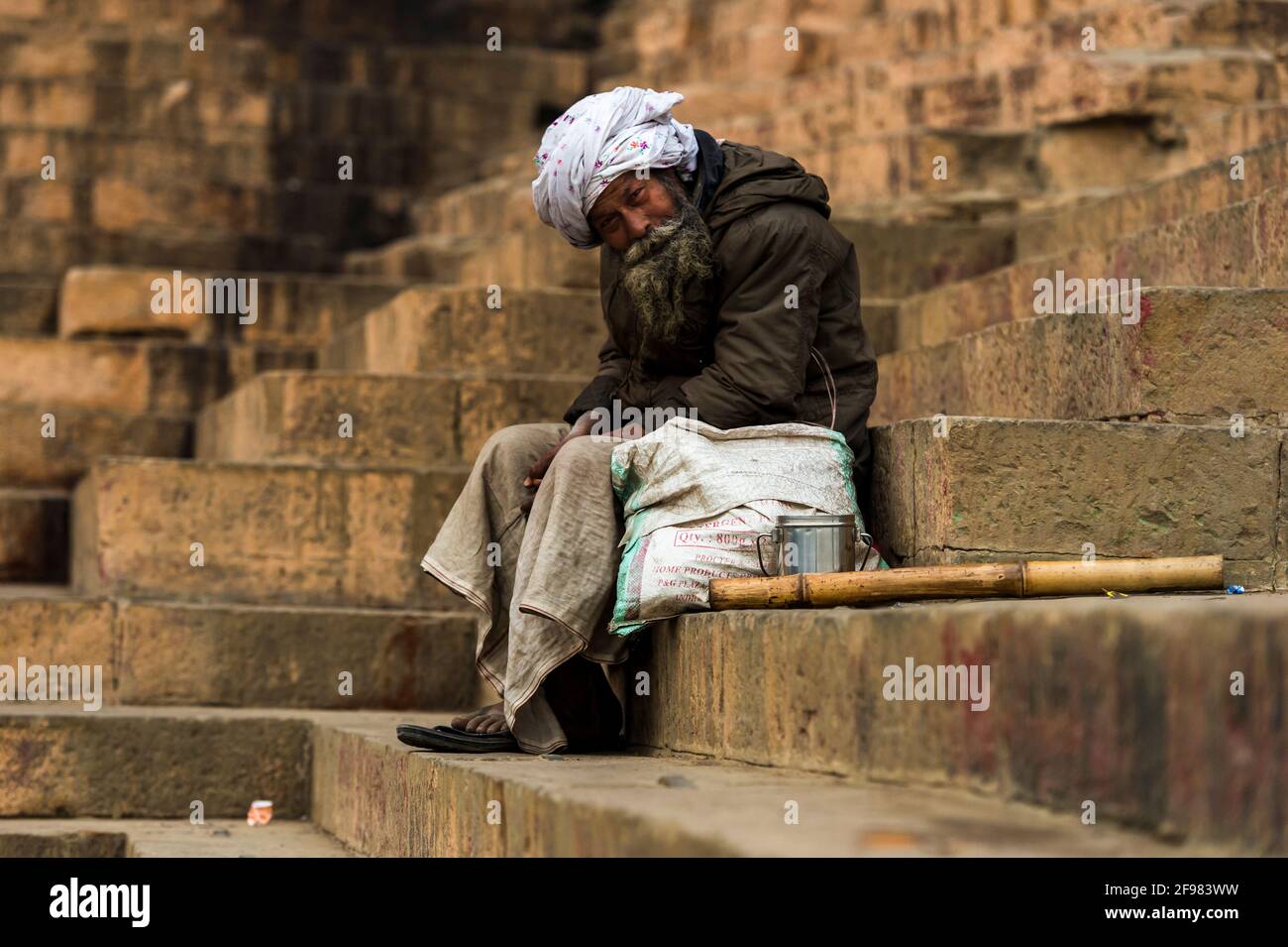 India, Varanasi, scenes at Dasaswamedh Ghat, stairs, beggars, sitting ...
