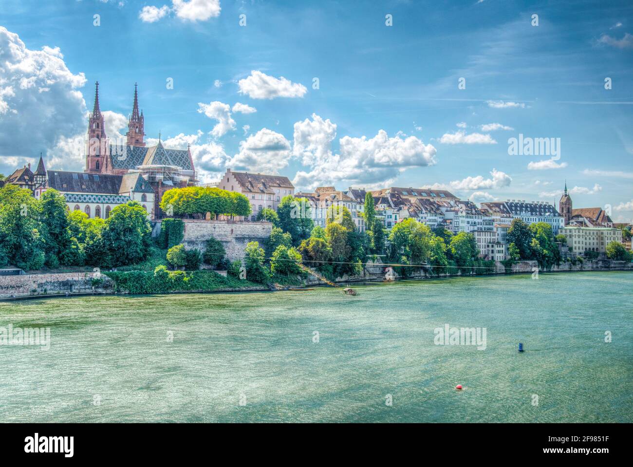 Riverside of Rhine in Basel dominated by majestic building of Munster ...