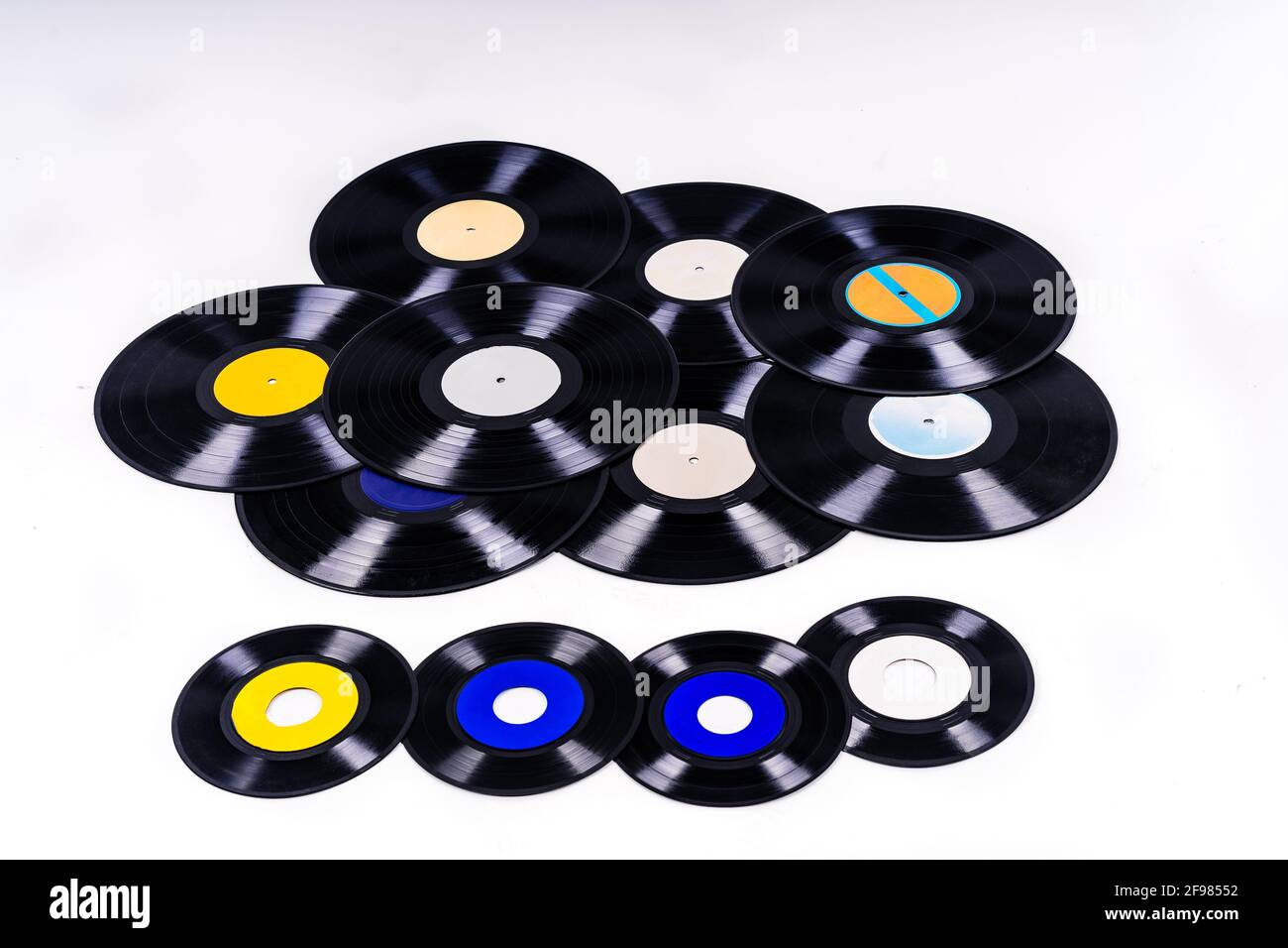 Collection of vinyl records on white background photographed in photo ...