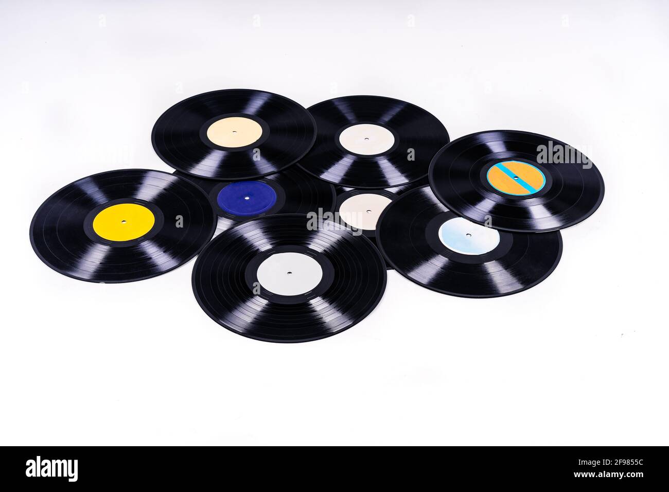 Collection of vinyl records on white background photographed in photo ...