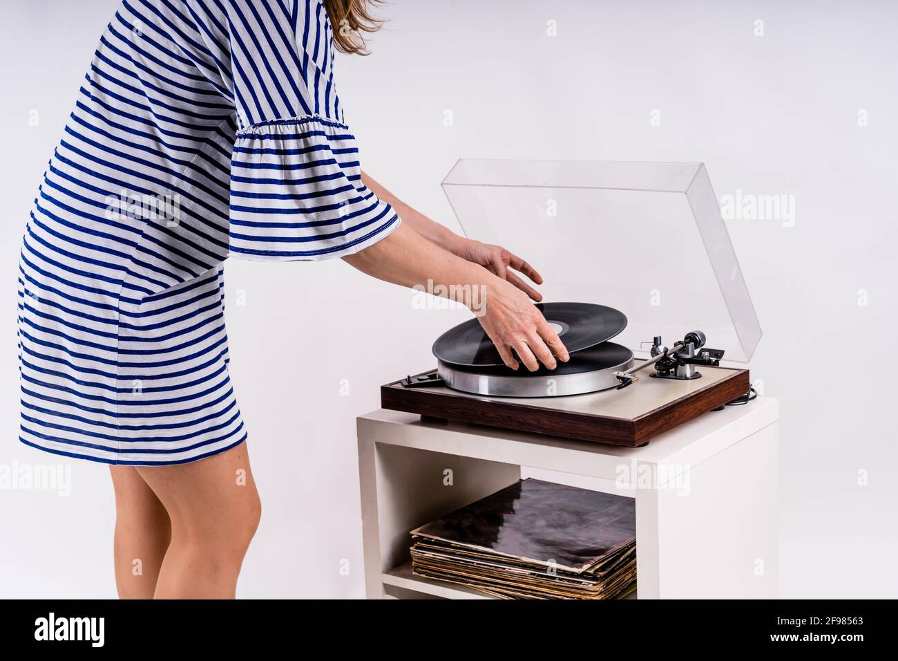 Woman putting on music in hi-res stock photography and images - Alamy
