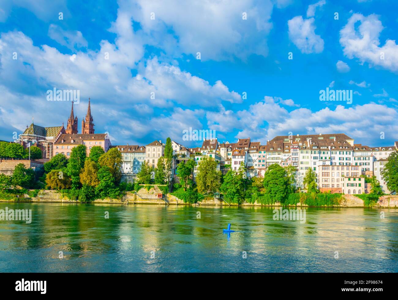 Riverside of Rhine in Basel dominated by majestic building of Munster ...