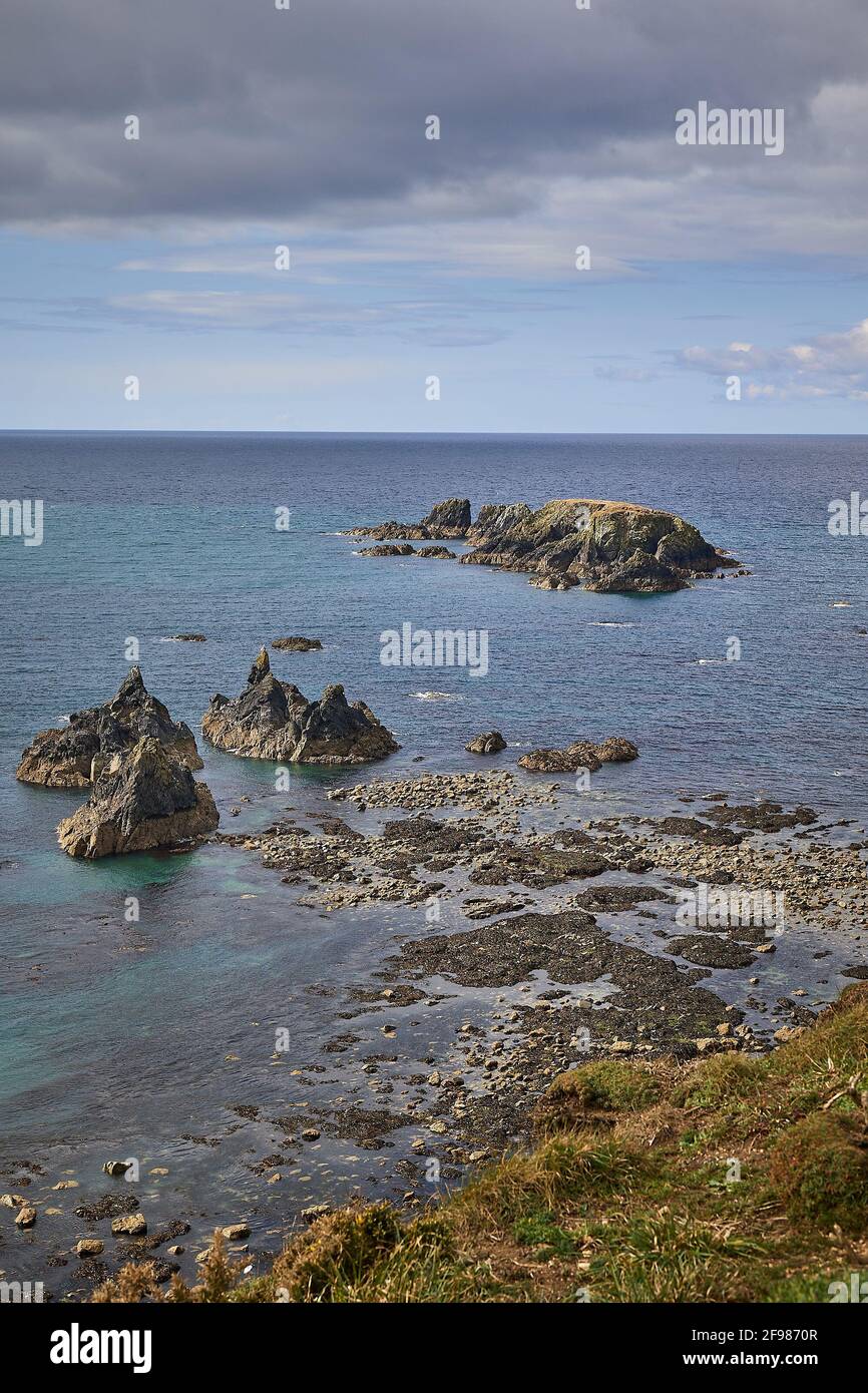 cave in huge rocky cliffs of the Kilfarrasy Beach. Co.Waterford ...