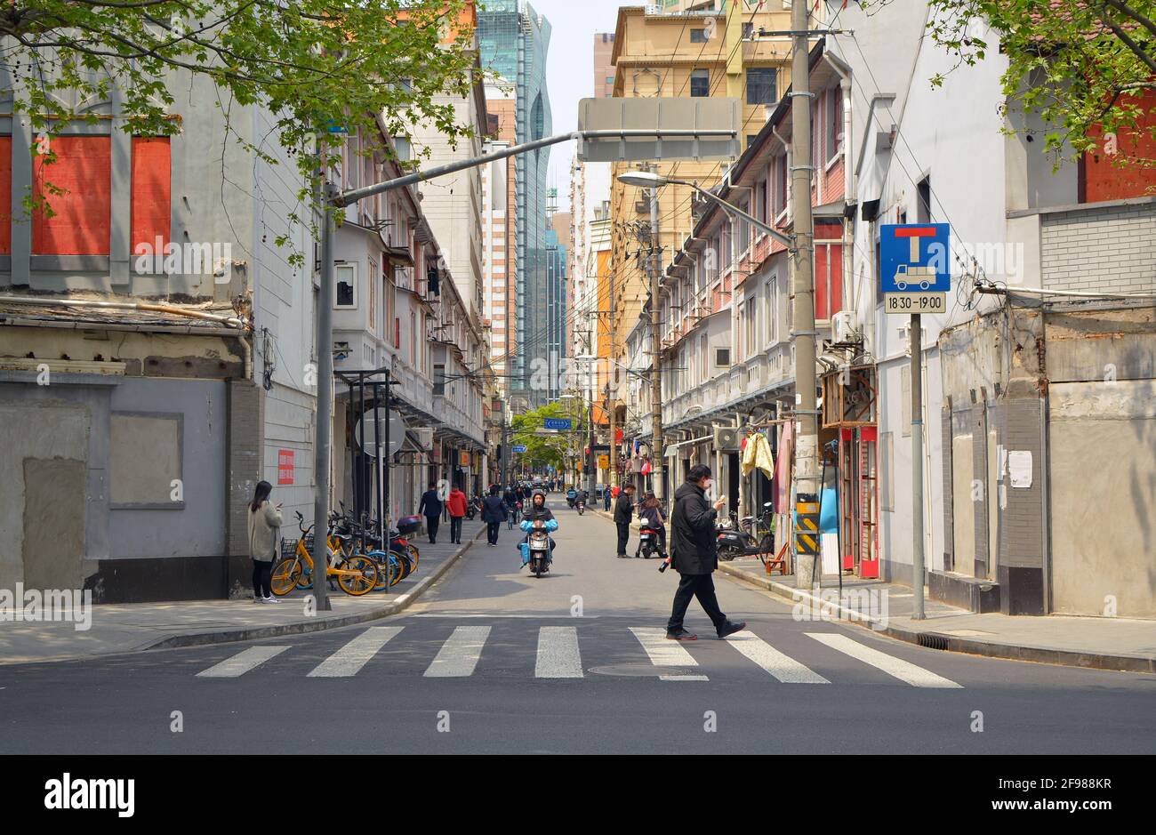Everyday scene in downtown Shanghai, people go about their daily ...