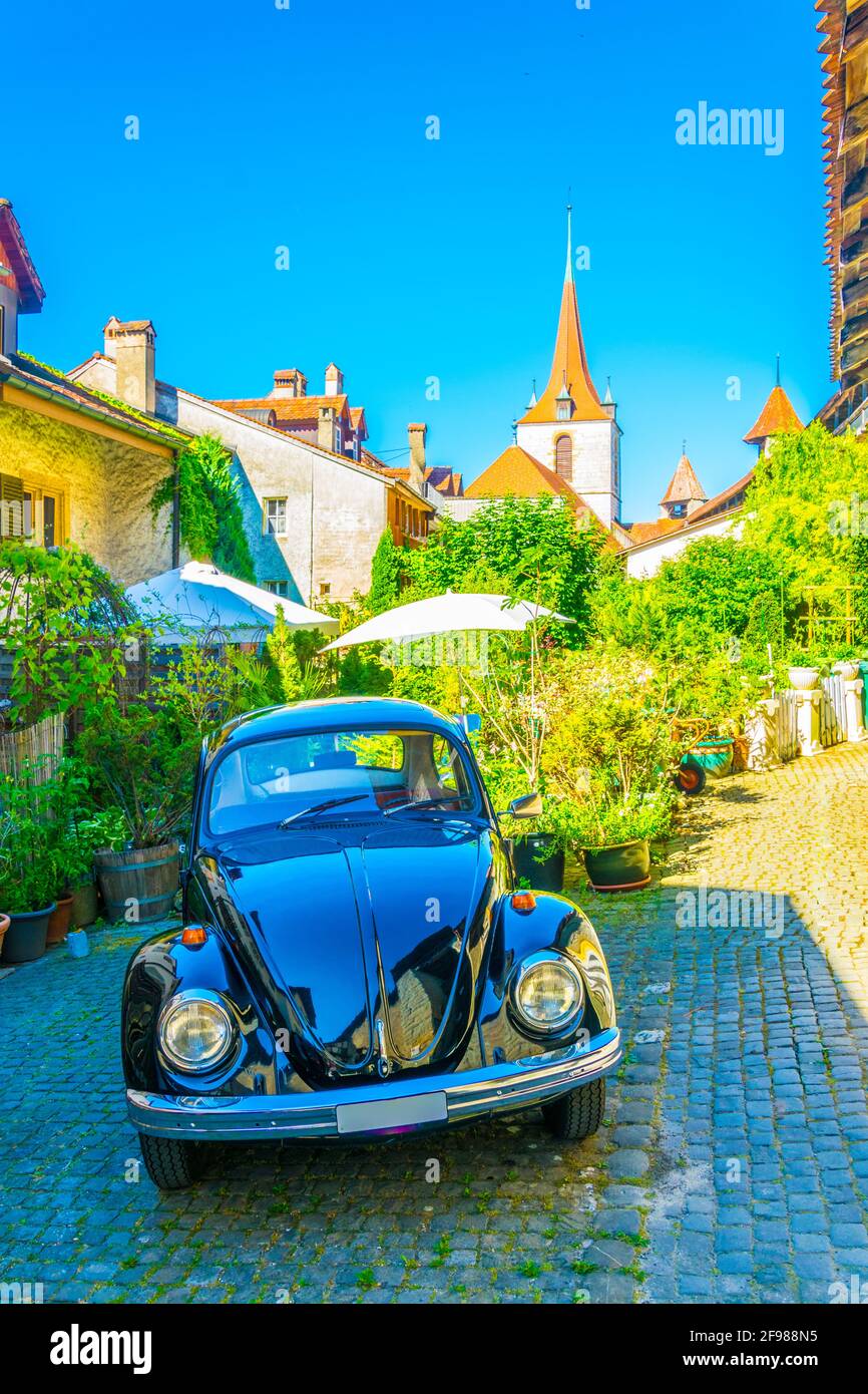 Vintage car park under fortification in Murten, Switzerland Stock Photo ...