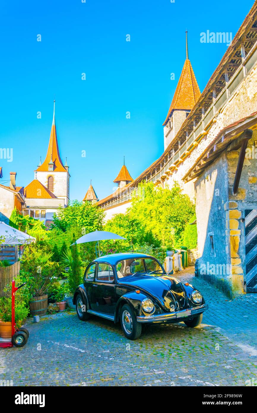 Vintage car park under fortification in Murten, Switzerland Stock Photo ...
