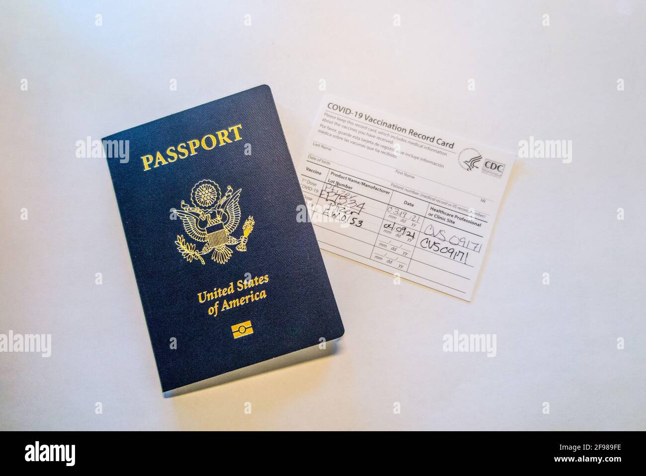 A United States passport with the CDC official Covid 19 vaccination ...