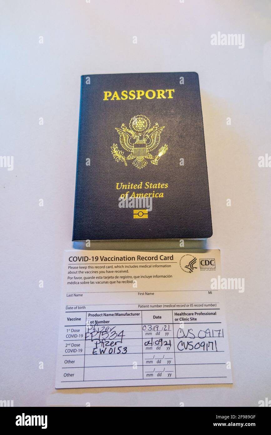 A United States passport with the CDC official Covid 19 vaccination ...