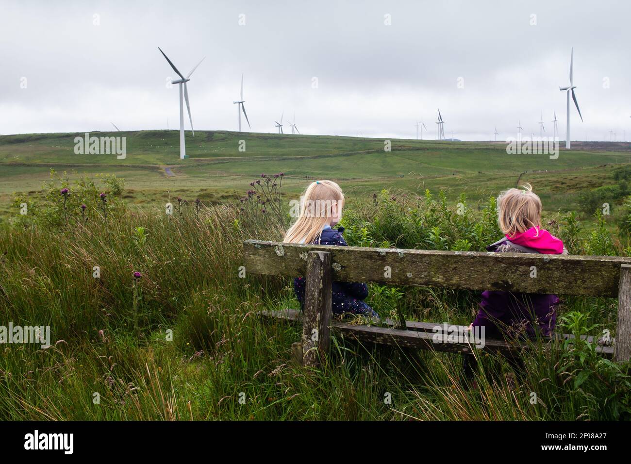 Two childern at a wind farm Stock Photo - Alamy