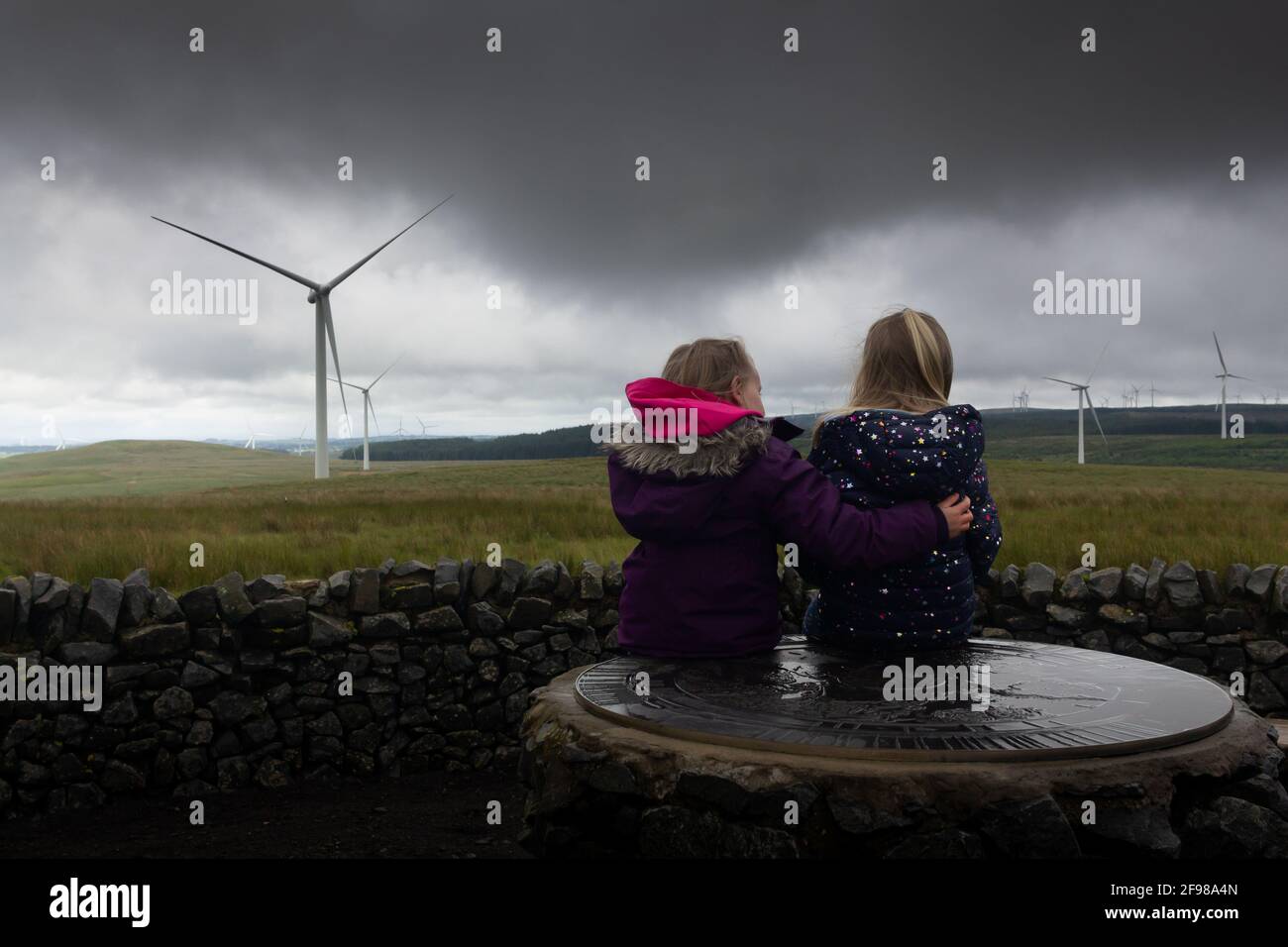 Two childern at a wind farm Stock Photo - Alamy