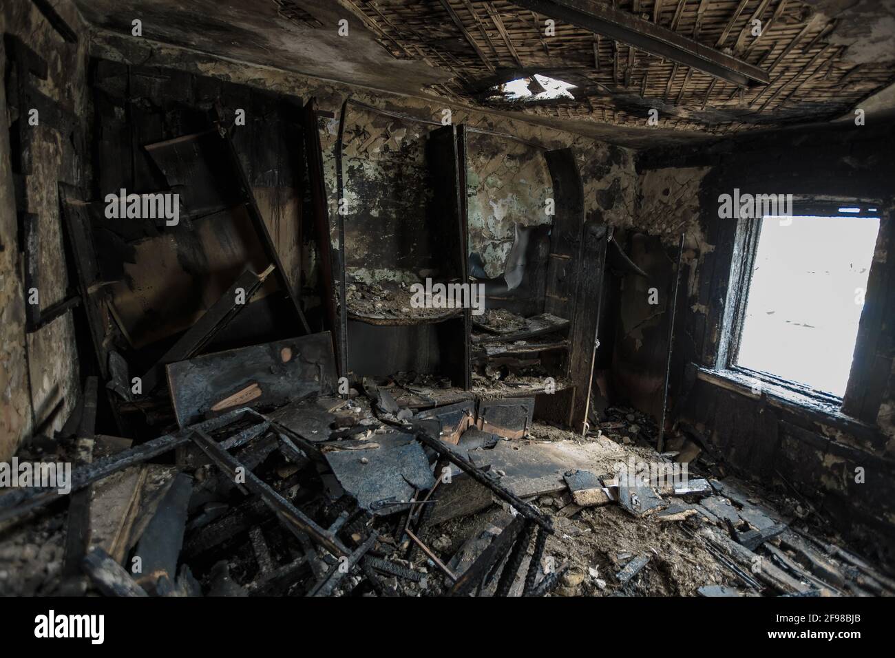 Burnt wooden house interior. Consequences of fire Stock Photo - Alamy