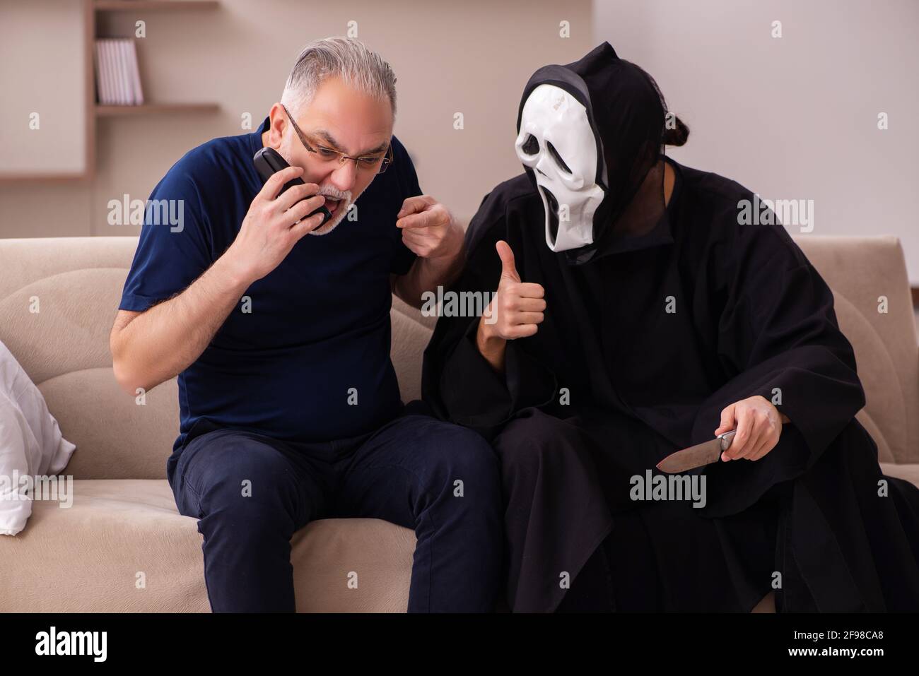 Devil coming to old dying man Stock Photo - Alamy