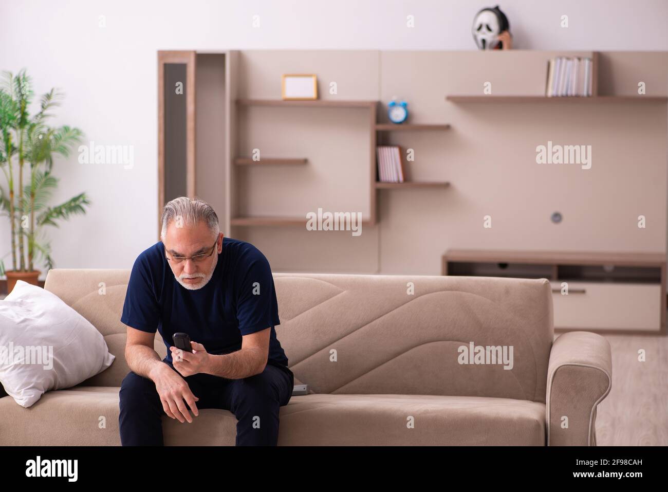 Old man phone evil hi-res stock photography and images - Alamy